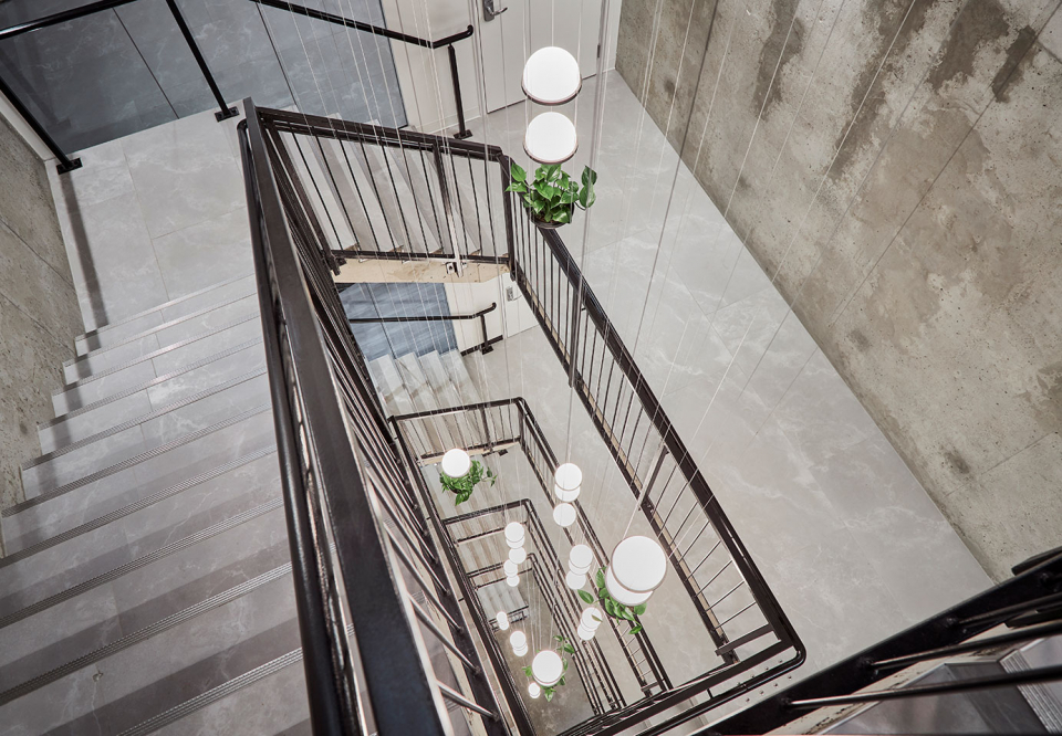 An industrial space meets cosy lighting | Vibia